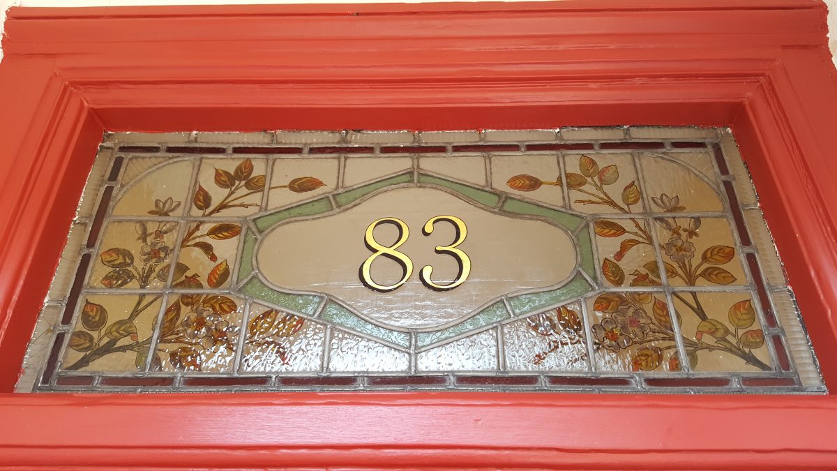 Signwriting restoration on glass at residential property - Traditional ...