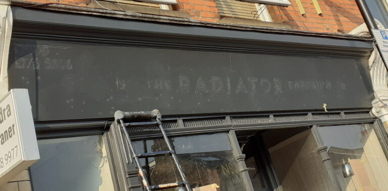 Gold leaf sign writing on fascia board - Traditional Signs of London