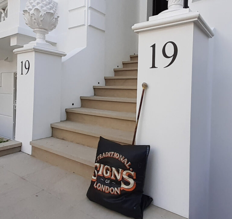 Painted property numbers on piers - Traditional Signs of London